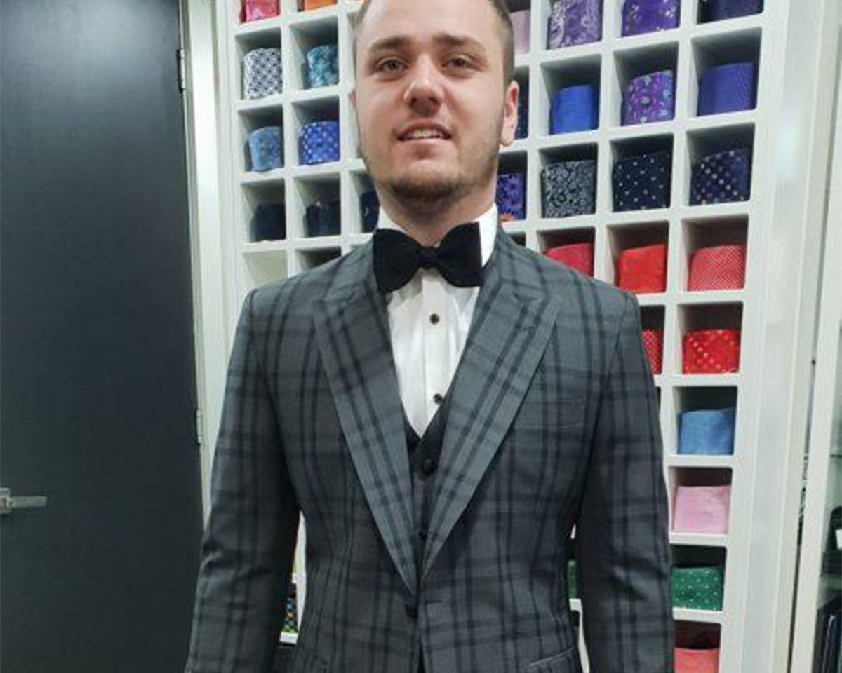 Regan finally picking up his bespoke suit.